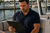 Man on a boat checking a clipboard as he adjusts charter pricing models ...