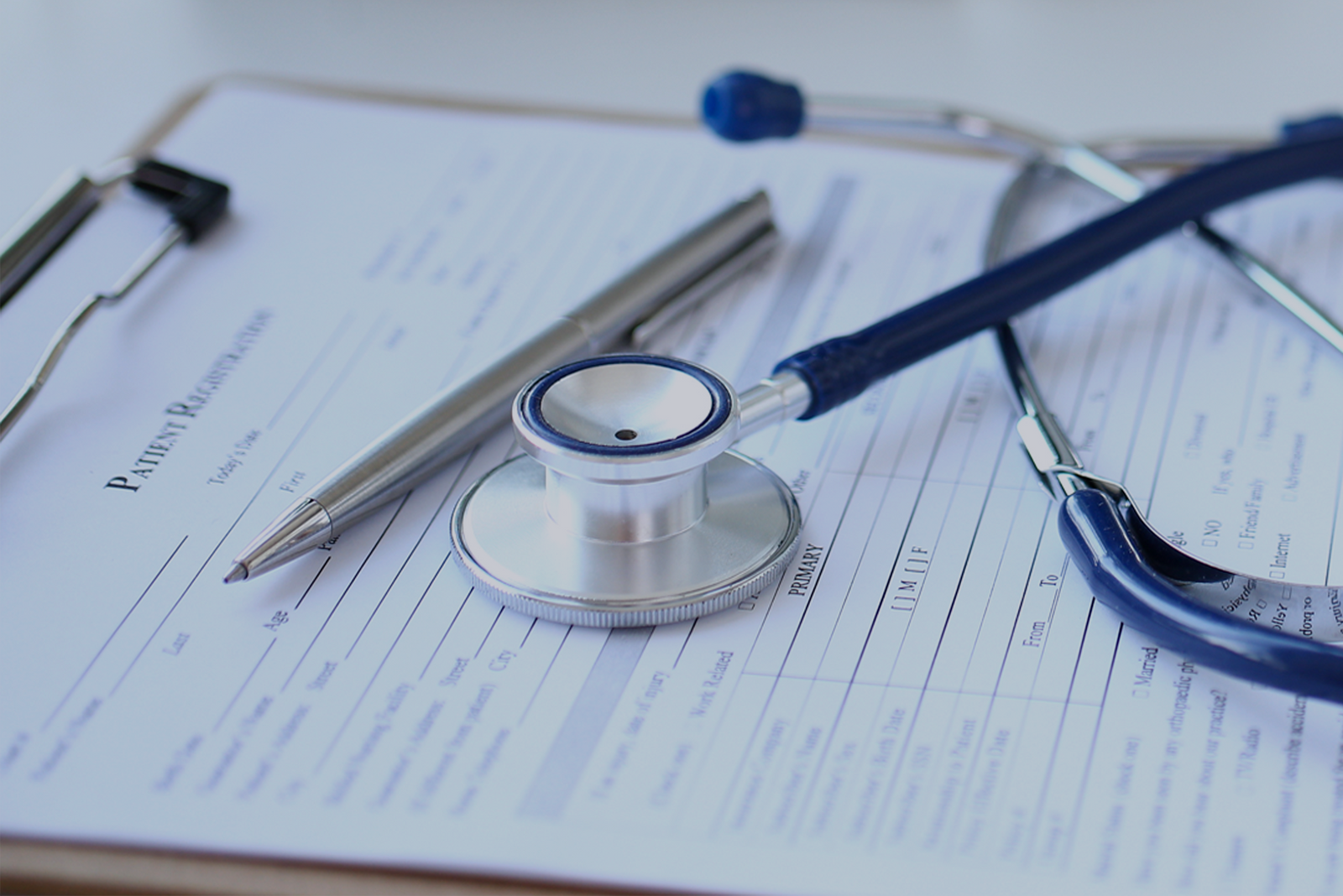 Stethoscope and pen on a patient registration form used for a captain’s ...